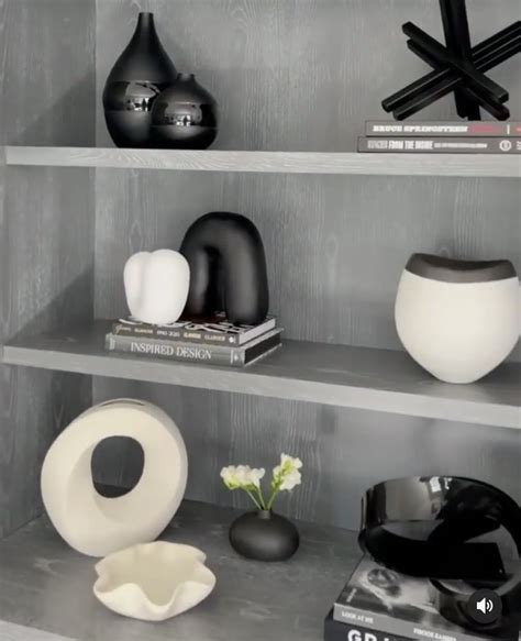 Modern White Wall Shelves With Vases And Books