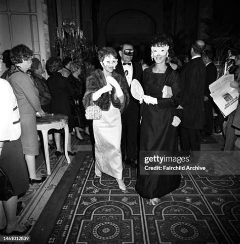 Two Women And A Man All In Masks Arriving At Truman Capotes Black