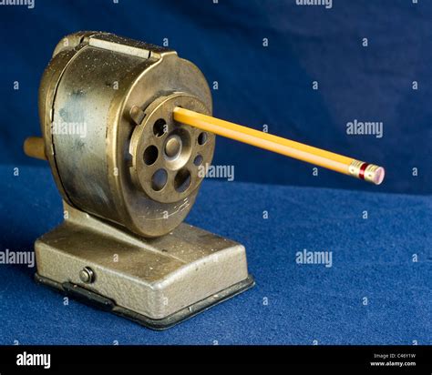 A Dirty Antique Style Pencil Sharpener With Pencil Inserted Stock Photo Alamy
