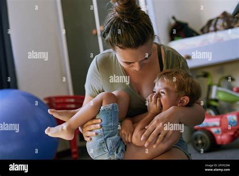 Its All Fun And Games With Mom A Young Woman Bonding With Her Son At
