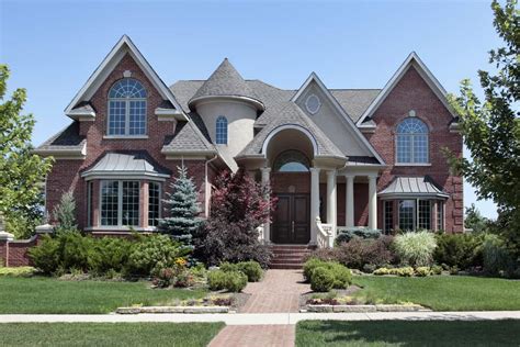 Fancy Home With Turret Column Bay Windows Steeply Peaked Roof Lines
