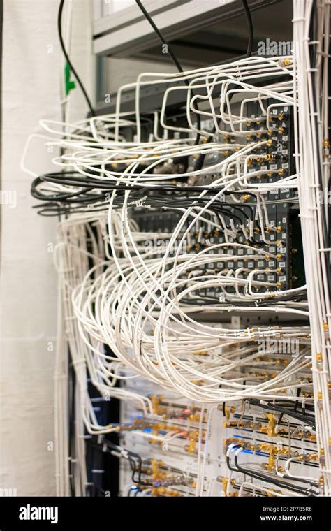 Electronic Signal Processing Devices In A Science Lab Many Connected Cables In Sockets