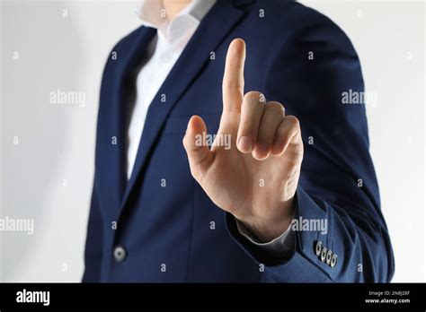 Man Scanning Fingerprint On Light Grey Background Closeup Stock Photo Alamy