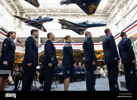 Air Force Combat Systems Officers Stand To Receive Their Wings During A