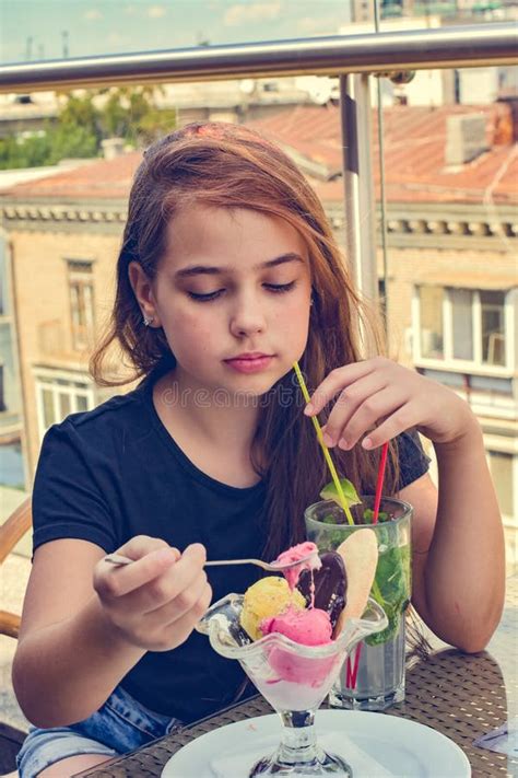 Teen Girl Happy Smiling Looking At Camera Sitting In Restaurant Or
