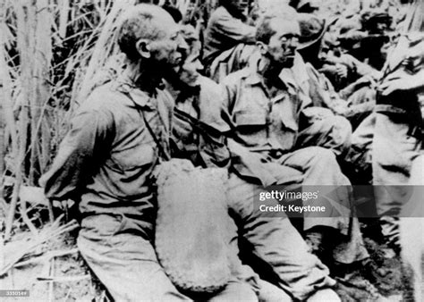 American Prisoners Of War Are Shown With Their Hands Tied Behind