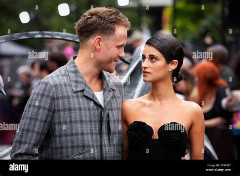 Josh Dylan Left And Anya Chalotra Pose For Photographers Upon Arrival At The World Premiere