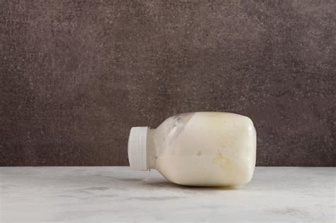 Premium Photo Spoiled Curdled Milk Bloated Bottle Improper Storage Of