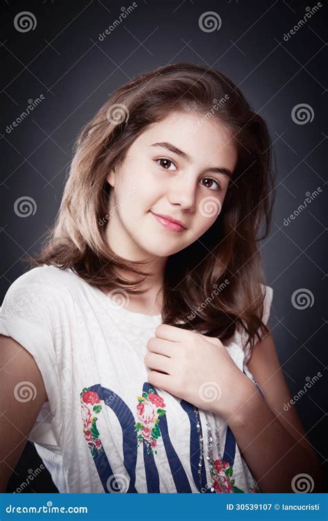 Beautiful Teen Girl With Long Straight Hair Posing On Background Stock