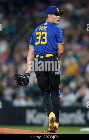 Seattle Mariners Starting Pitcher Bryan Woo Reaches For The Ball From