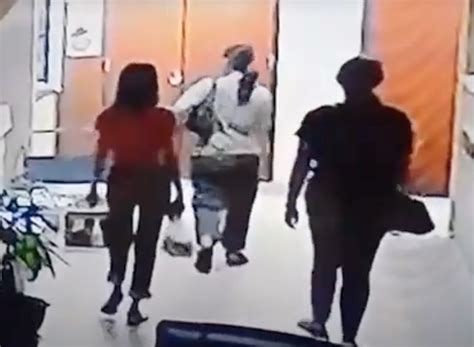 Woman Frantically Fighting Off A Python Hiding Under Trolley