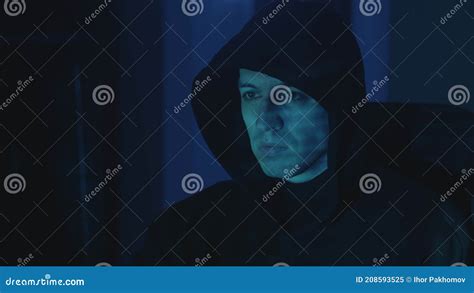 Hooded Dangerous Hacker Programmer Working On Computer Scheming Cyber