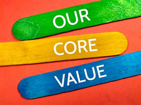 Premium Photo Business Concepttext Our Core Value On Wooden Stick With Red Background