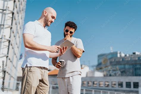 Architects And Construction Engineers Collaborating On City Project Analyzing Blueprints And