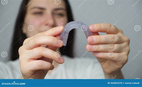 A Woman Showing Dental Mouthguard Splint For The Treatment Of