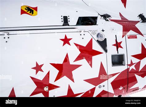 Swiss Helicopter Close Up Side View With Red And White Stars On Chassis