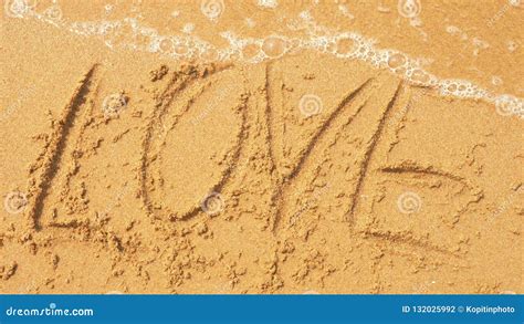 The Sea Wave Erases The Inscriptions Written On The Sand Top View Stock Photo Image Of Sunny