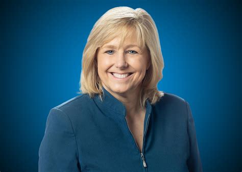 Diana Monn 2 Blue Background Lifestyles Realty Inc