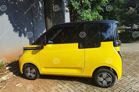 Photo Of Small Electric Car With A Yellow Color Stock Image Image Of