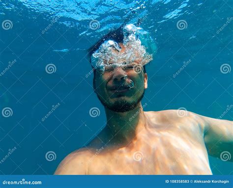Man Is Drowning In A Deep Blue Sea Under The Water Stock Image Image