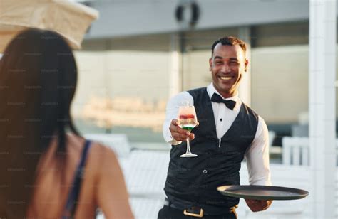 Order For Woman Black Waiter In Formal Clothes Is At His Work Outdoors