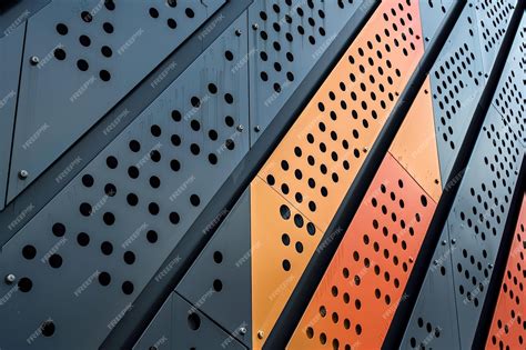 Modern Steel Angular Geometric Cladding With Colour Tones And Perforated Patterned Design