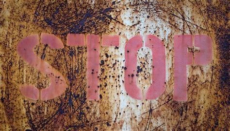 Premium Photo Stop Rusting On The Steel Wallold Stop Signs That Ruststreaks Of Rustrust Of