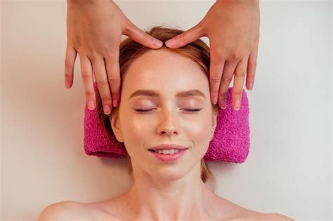 Premium Photo Red Haired Ginger Woman In Spa Gets A Facial Massage