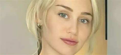 Miley Cyrus Shows Off Her Daring Style Opting For A Topless Look Under A Sleek Taupe Coat In A