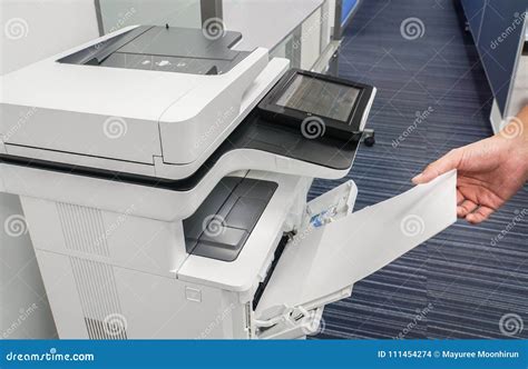 Businessman Hand Put Blank Paper Sheet Into Printer Input For Copying And Scanning Documents