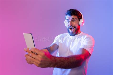Bearded Man Holding Laptop In Neon Light Stock Image Image Of Screen Holding 319290869