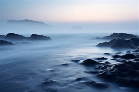 Premium AI Image Mystifying Morning Serenity Captivating Sea Ripples And Floating Fog