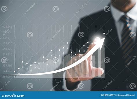 Businessman Pointing Arrow Graph Growth And Financial Network