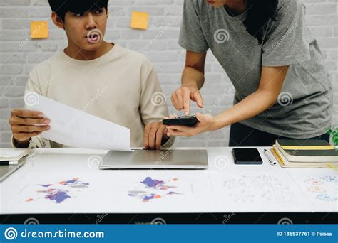 Man Woman Colleagues Analyzing Data On Computer Startup Teamwork Team Working At Office Stock