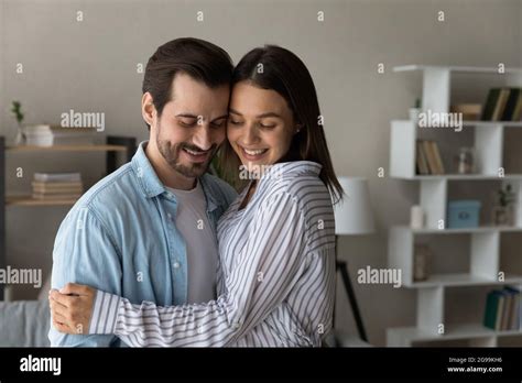 Couple In Love Cuddling Standing Inside Of Modern House Stock Photo Alamy