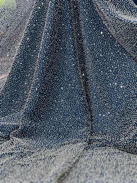 تور‌ منجوق دوزی سورمه‌ای پارچه سرای حسین