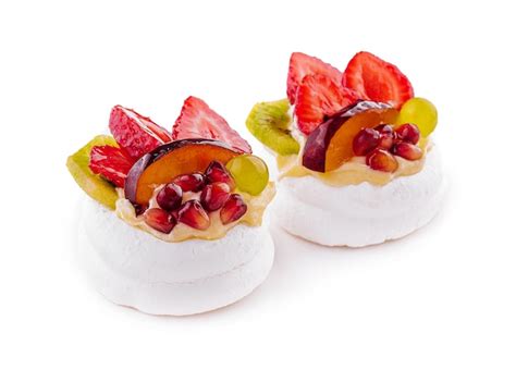 Premium Photo Mini Pavlovas With Whipped Cream And Fresh Fruit