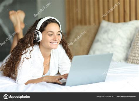 Woman Headphones Checking Laptop Bed Bedroom Stock Photo PheelingsMedia