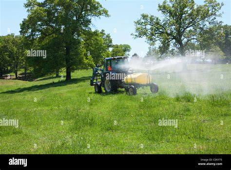 Spraying Herbicide On A Pasture Used For Grazing Beef Cattle The Herbicide Is To Control