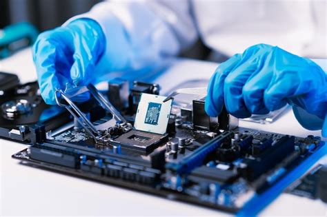 Premium Photo The Technician Is Putting The Cpu On The Socket Of The Computer Motherboard