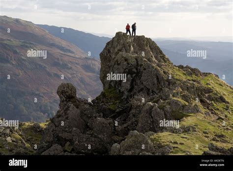Walkers On The Lion And The Lamb Helm Crag Grasmere Lake District