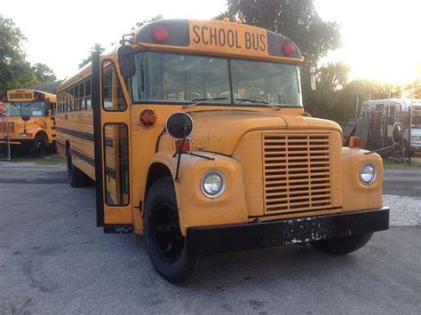 Vintage Yellow School Bus In A Parking Lot Old Yellow School Buses