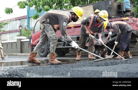 Process Of Asphalting Road Construction Infrastructure By Spreading