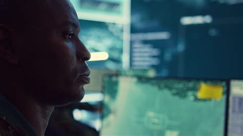 Lieutenant Colonel Gathering Intelligence From Federal Radar Systems Working With His Crew In