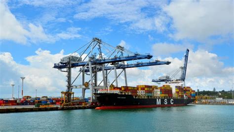 Cargo Ship And Container Cranes On Fergusson Wharf At Ports Of A