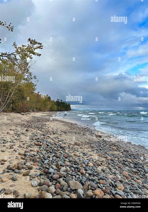 Beautiful Lakeshore Landscape With Trees And Rocks At The Waters Edge