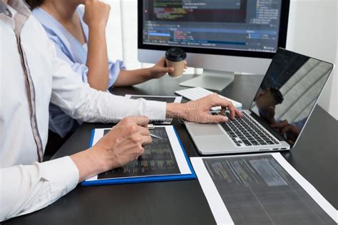 Team Of Programmers Working With Computer Programming Professional