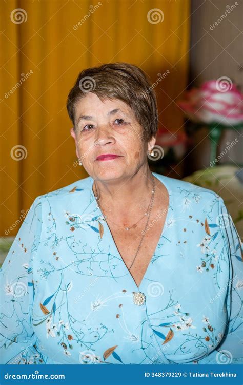 A 71 Year Old Russian Woman In An Elegant Festive Outfit Featuring A