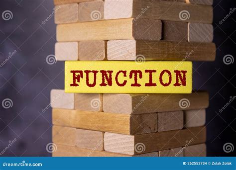Text On Gray Word Function In Small Wooden Letters With Black Font On A Blue Background Stock