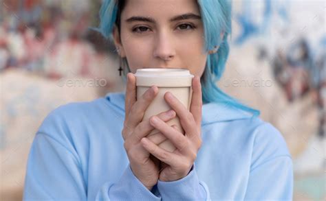 Blue Haired Teenage Girl In Light Blue Oversize Hoodie Staying Near